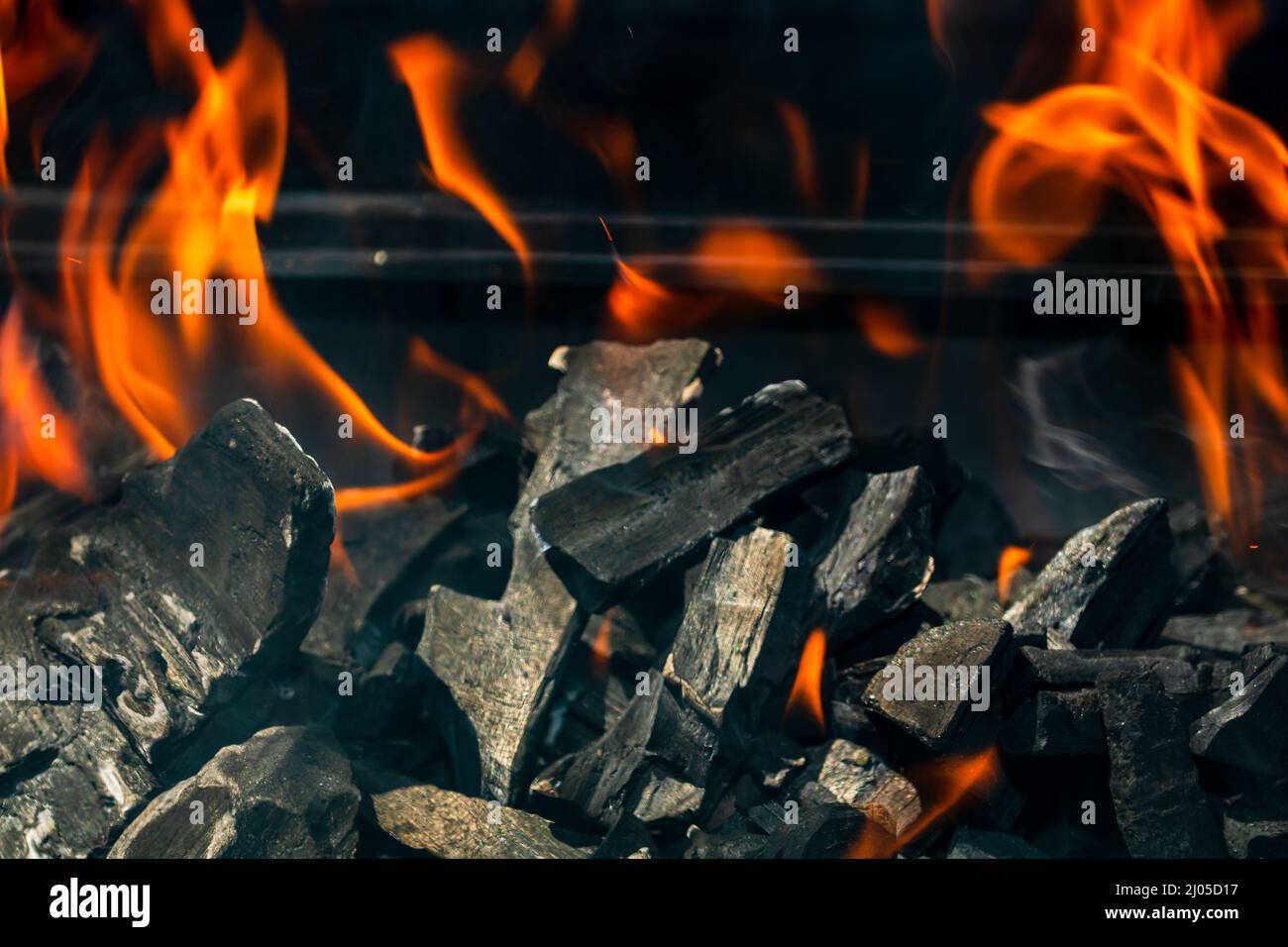 Barbecue grill pit with glowing and flaming hot open fire with red ...