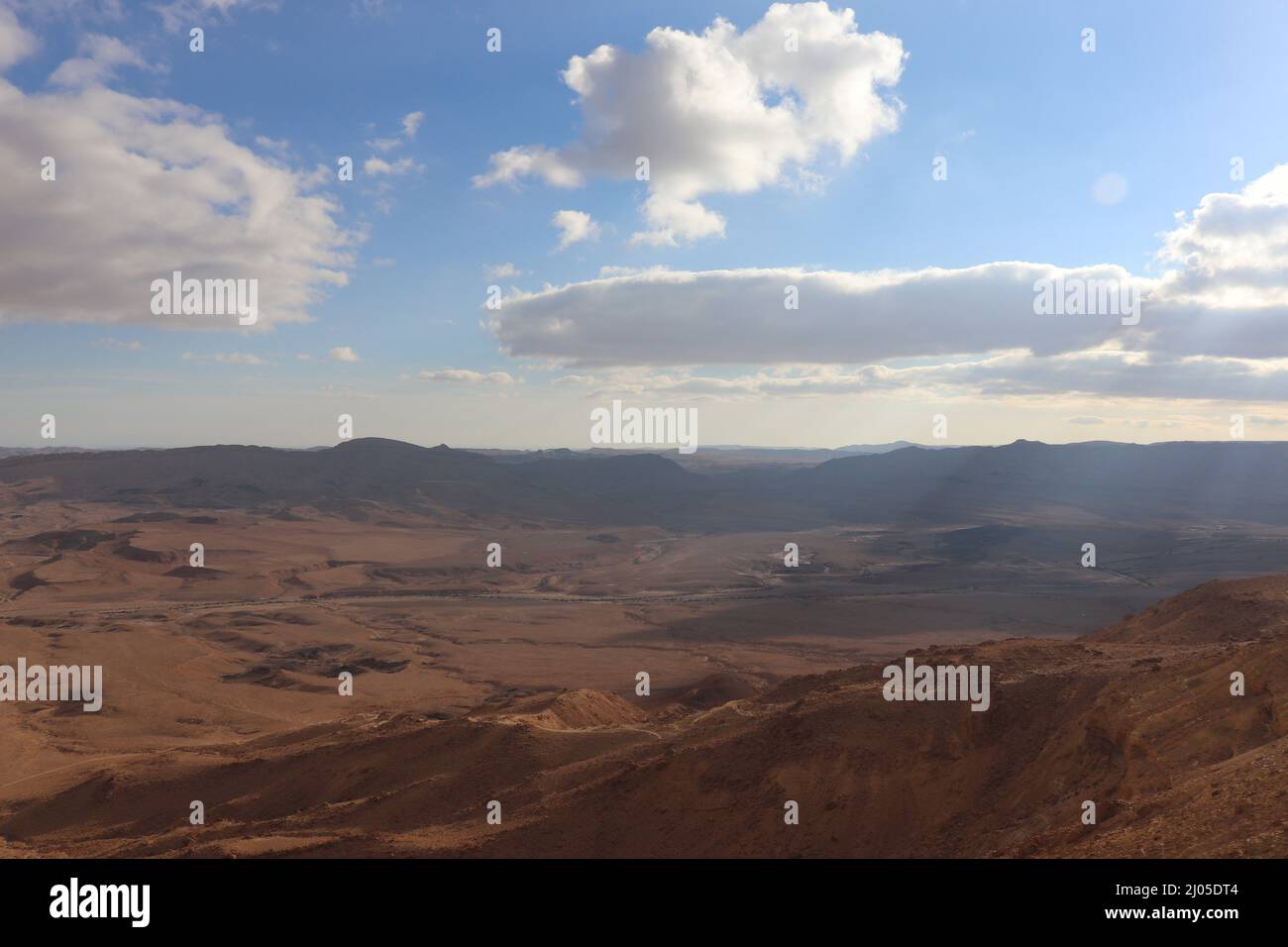 Desert landscape with cloudy sky Stock Photo - Alamy