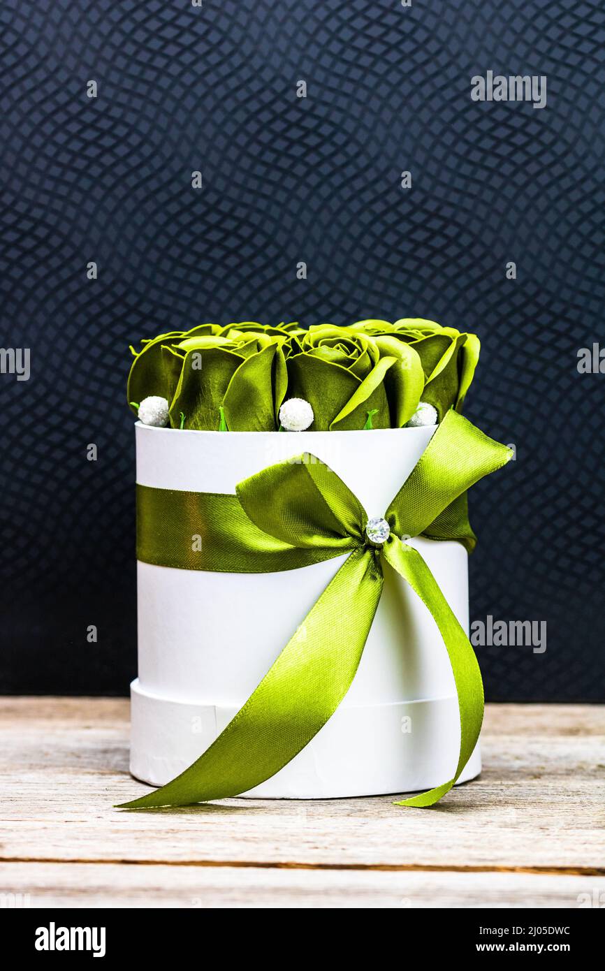 Green roses in a round luxury present box. Bouquet of flowers in a ...
