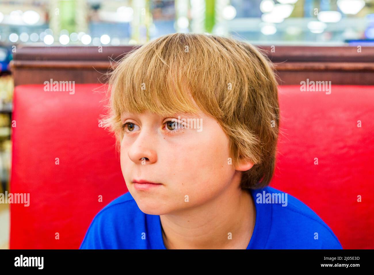 tired boy in a diners at night Stock Photo - Alamy