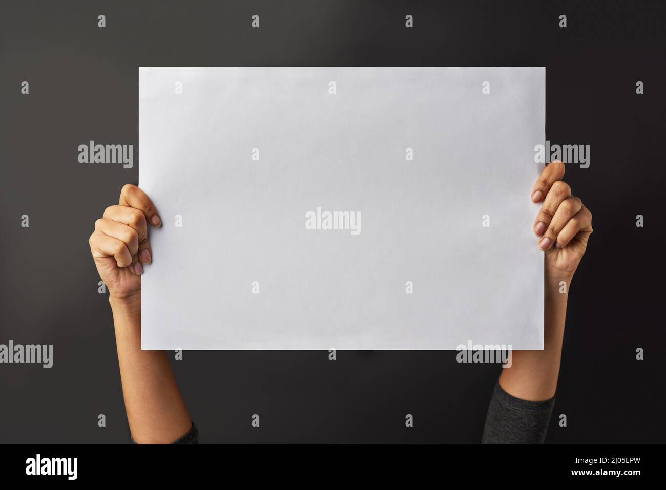 Leave your message here. Shot of a person holding up a blank page ...