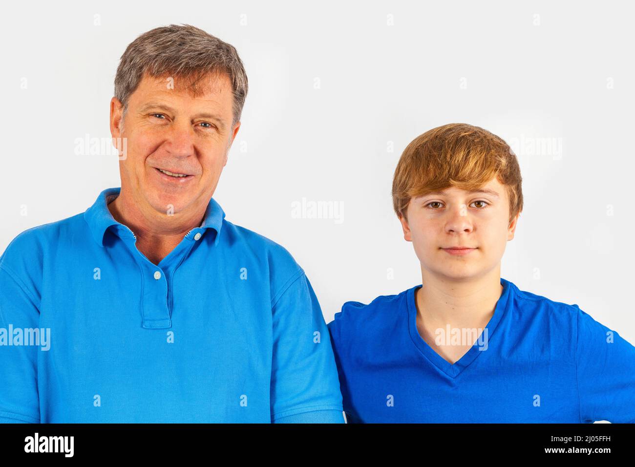 happy father with his sun in blue shirt Stock Photo - Alamy