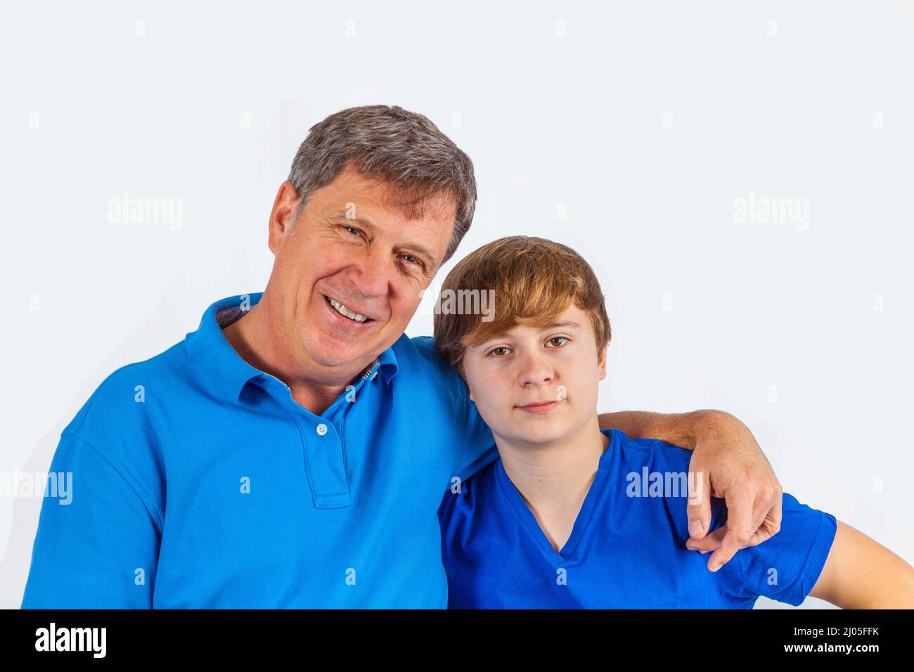 happy father with his sun in blue shirt Stock Photo - Alamy