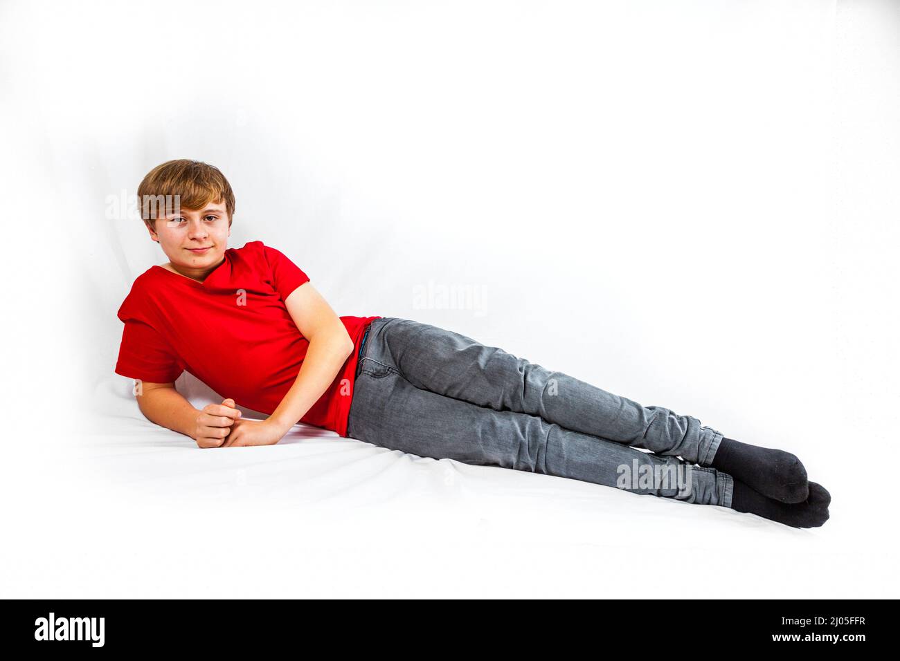 cute handsome boy lying at the floor Stock Photo - Alamy