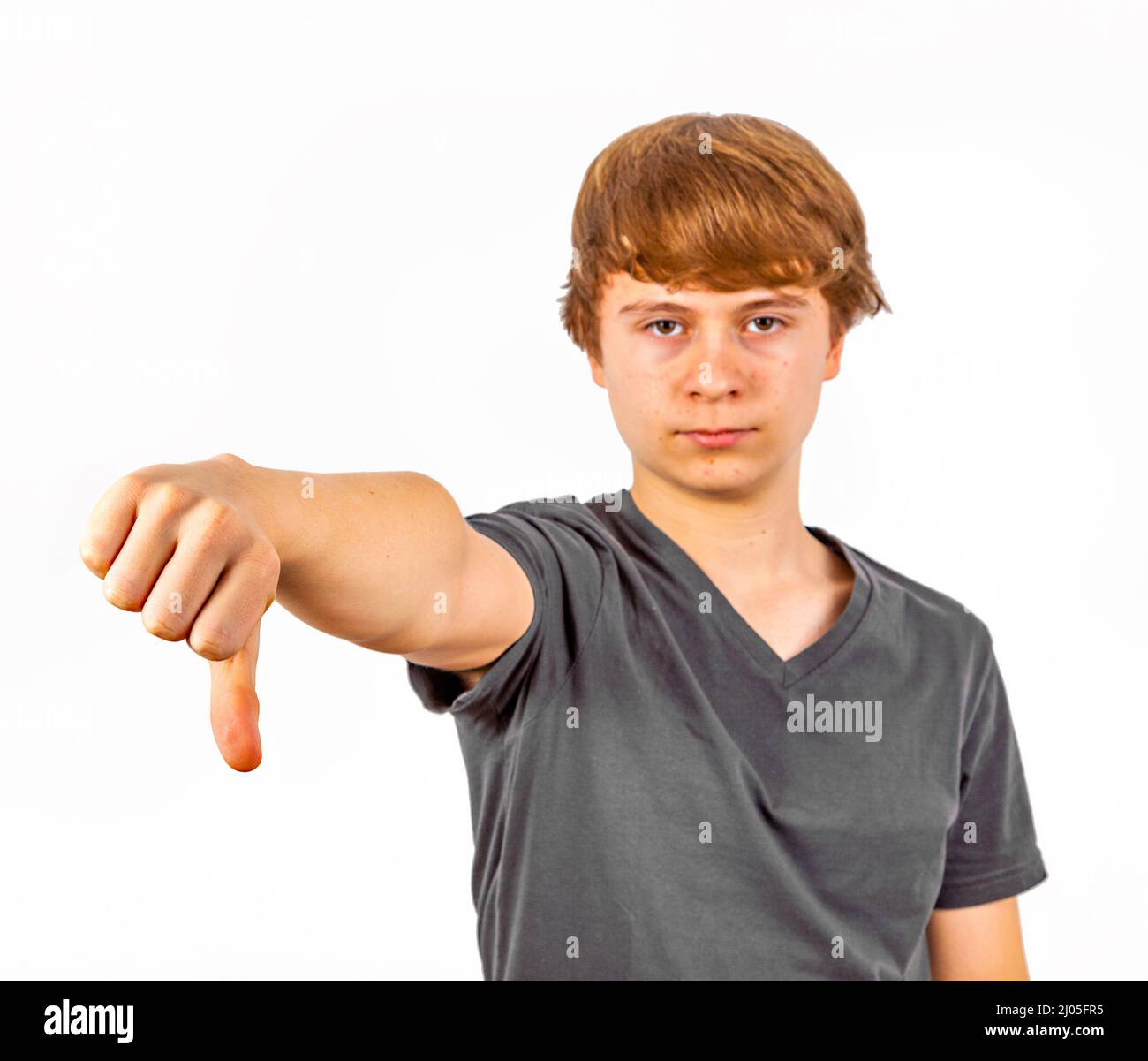 Teenage boy smiling showing thumbs down sign Stock Photo - Alamy Teenage boy smiling showing thumbs down sign Stock Photo - Alamy