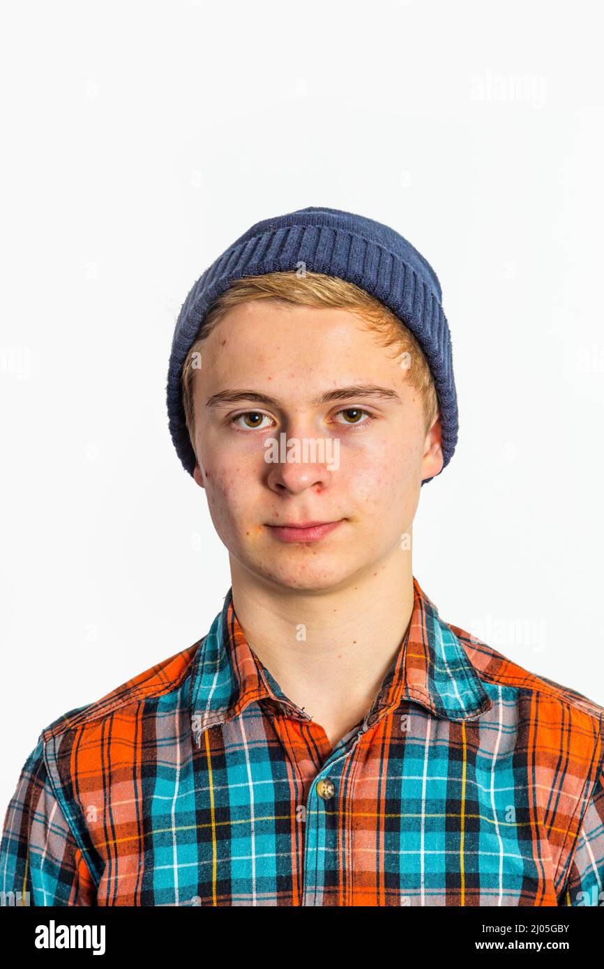 Portrait of a positive boy looking at camera. Isolated over white Stock ...
