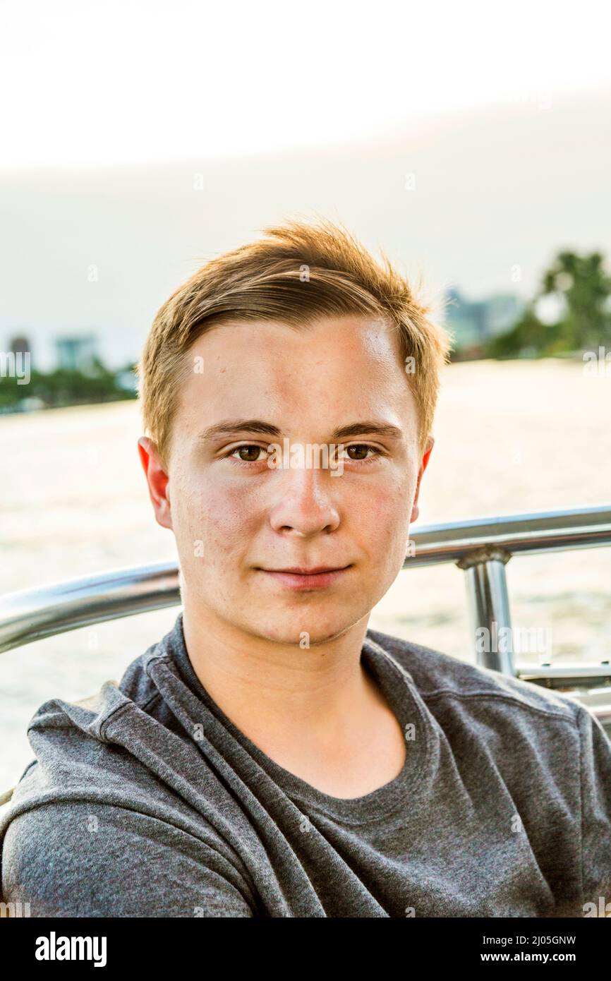 portrait of cute friendly boy on a boat Stock Photo - Alamy