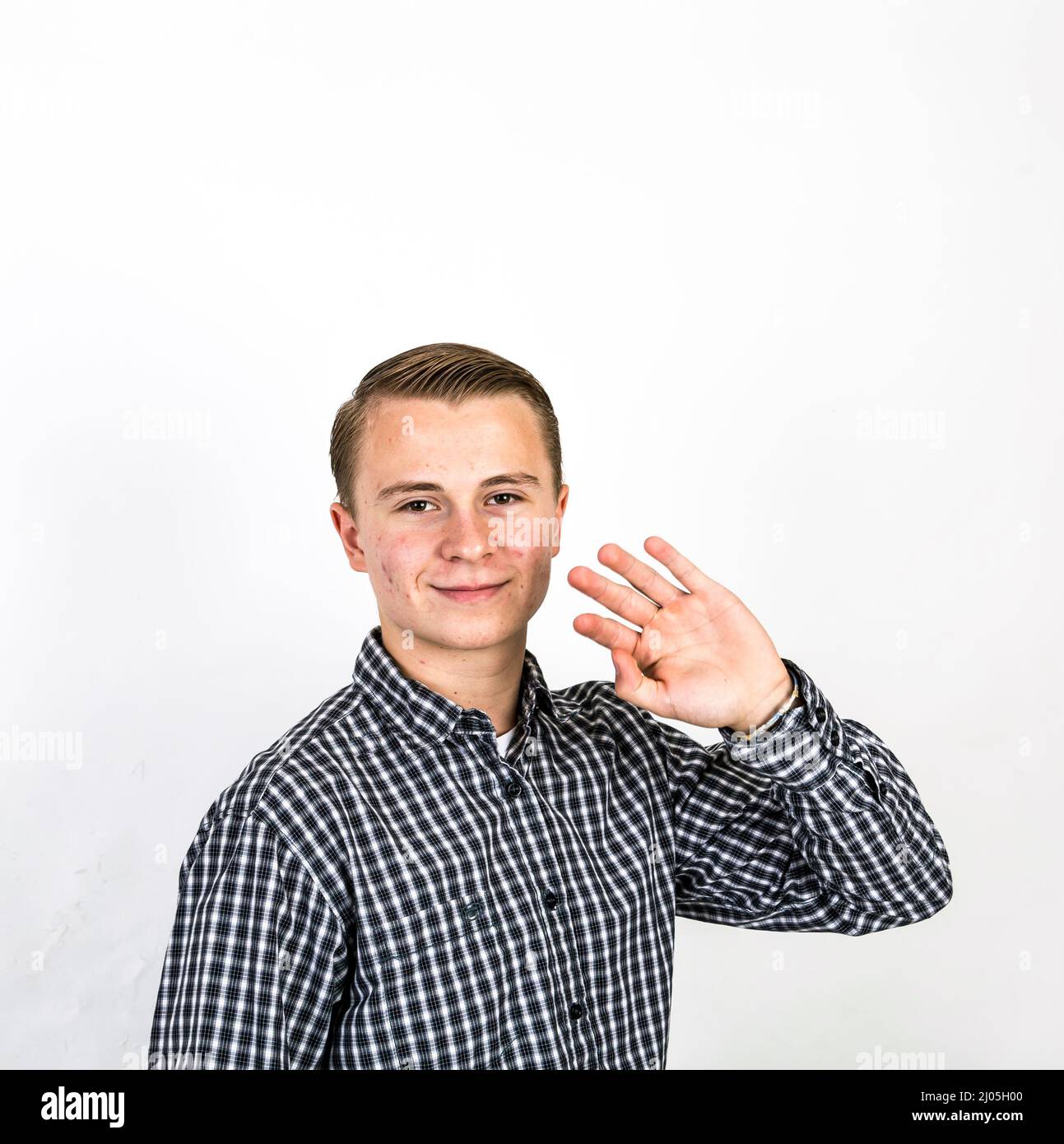 smart teenage boy greets with his hands Stock Photo - Alamy