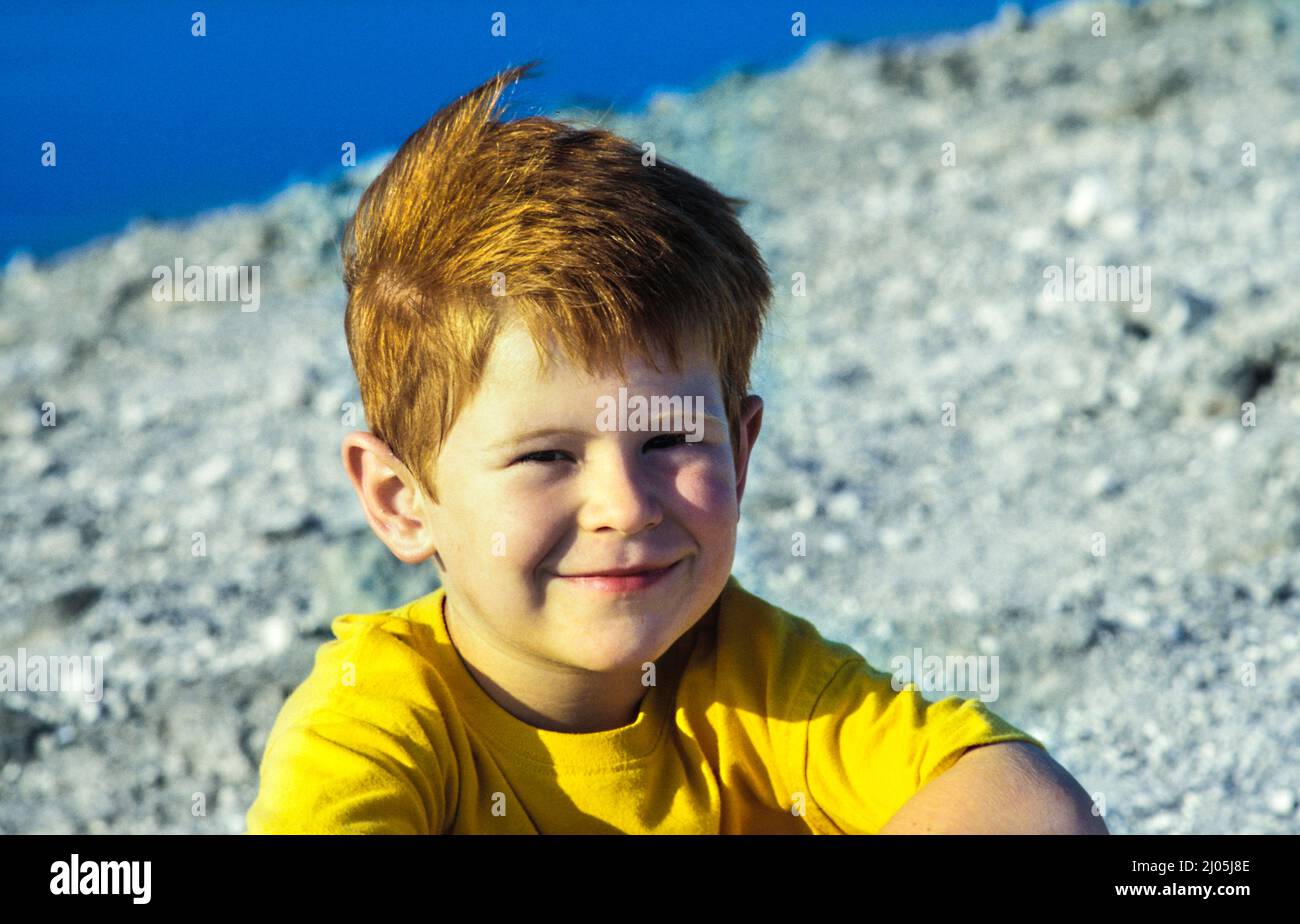 cute boy on a volcano tour in Italy on the stromboli Stock Photo - Alamy