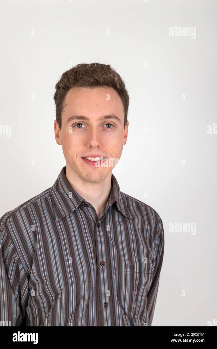 portrait of smart looking young man with white background Stock Photo ...