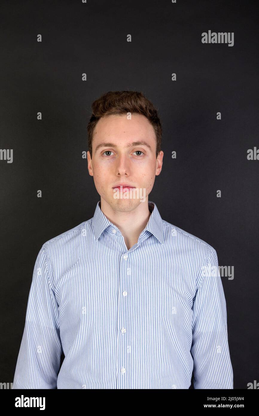 portrait of smart looking young man with white background Stock Photo ...