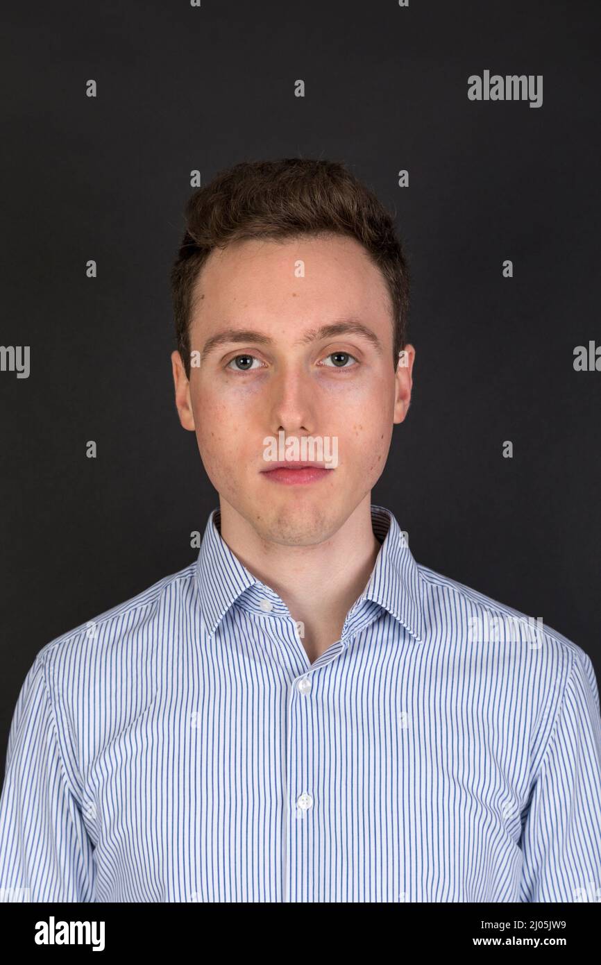 portrait of smart looking young man with white background Stock Photo ...