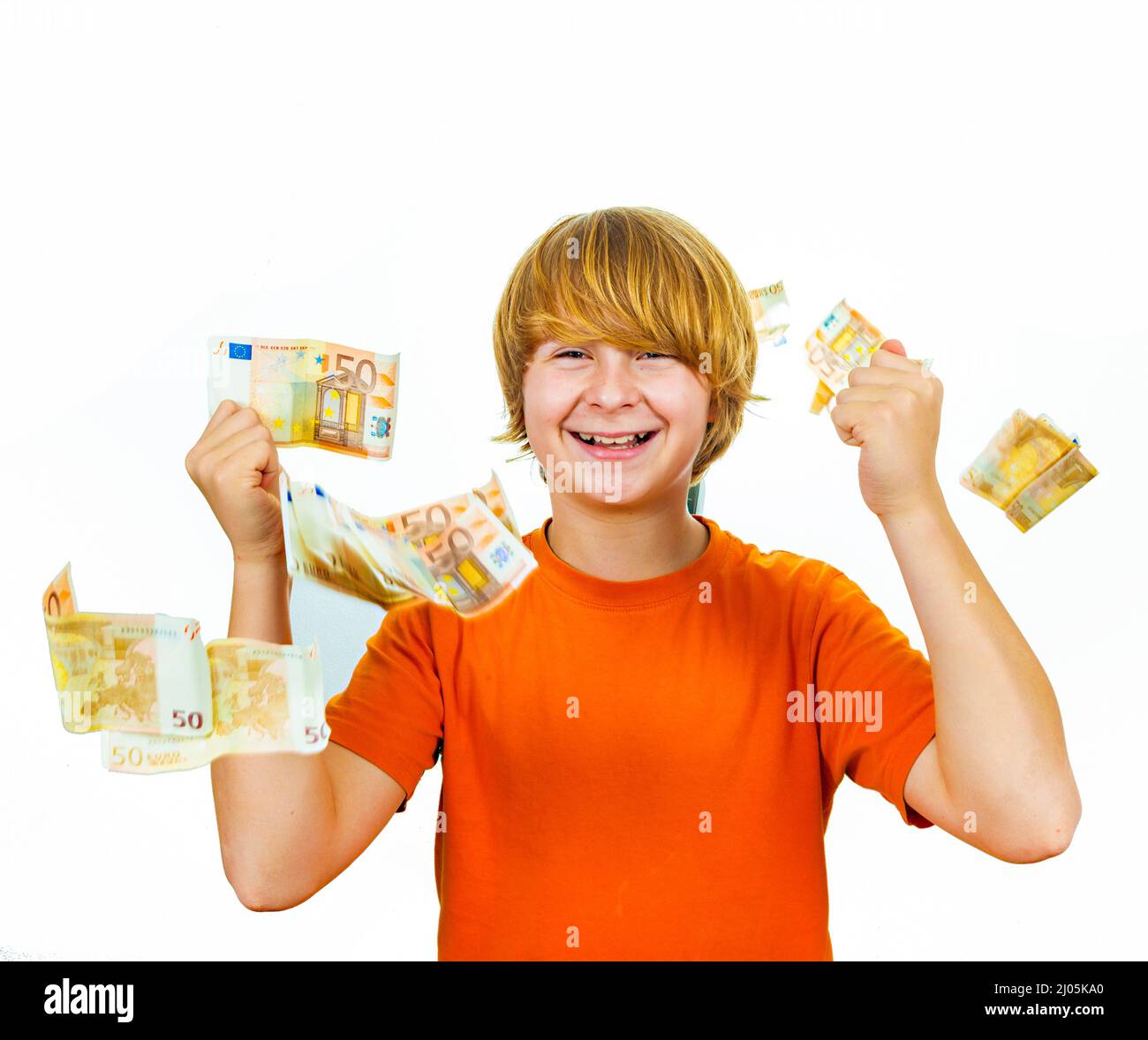 Euros flying around a laughing boys head Stock Photo - Alamy