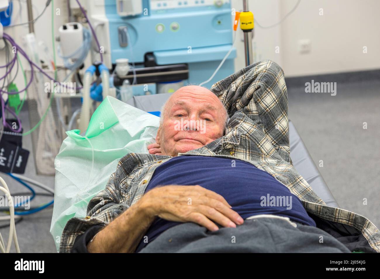 Sick Man In Hospital Bed Sick Man. Businessman Working On Hospital Bed