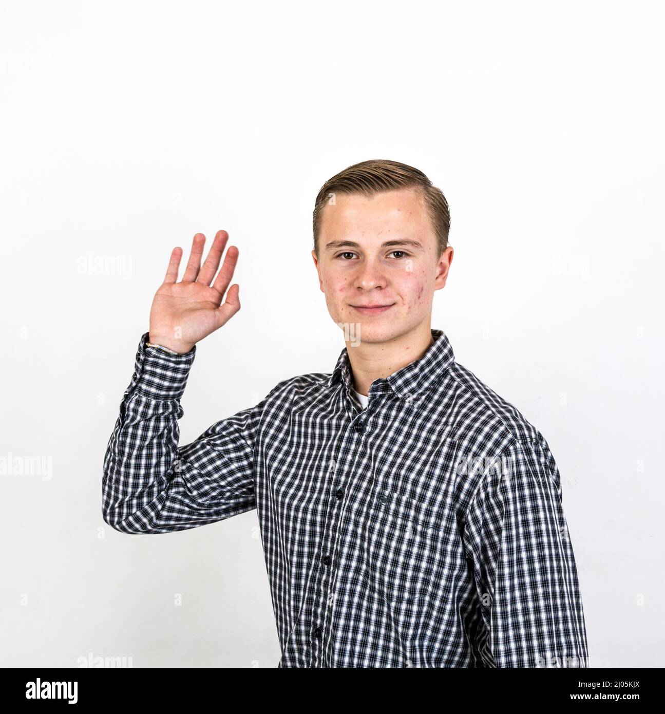 smart teenage boy greets with his hands Stock Photo - Alamy