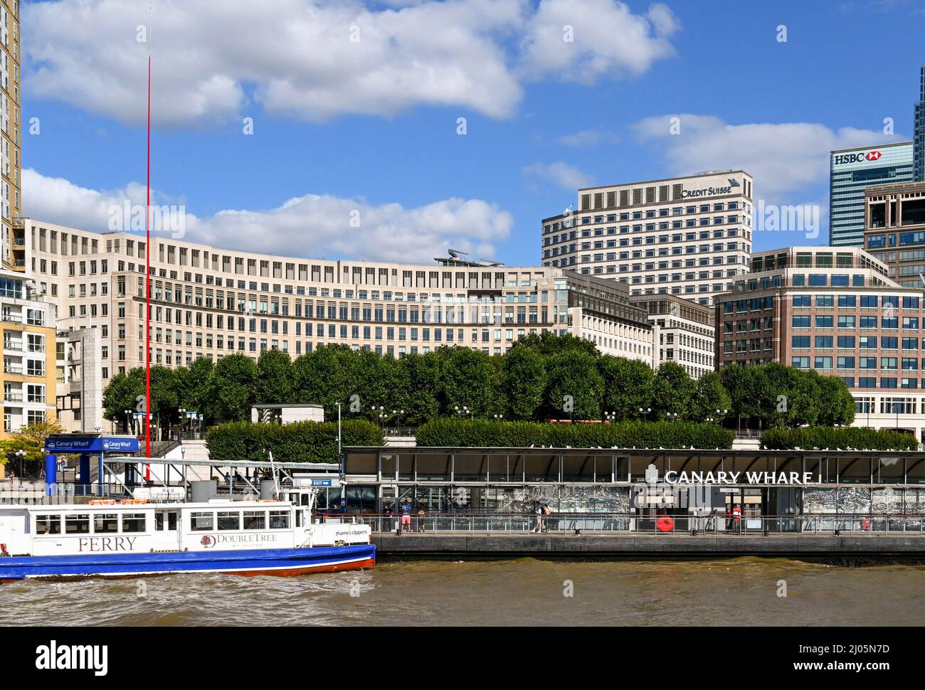 London, England - August 2021: Passenger ferry arriving at Canary Wharf ...