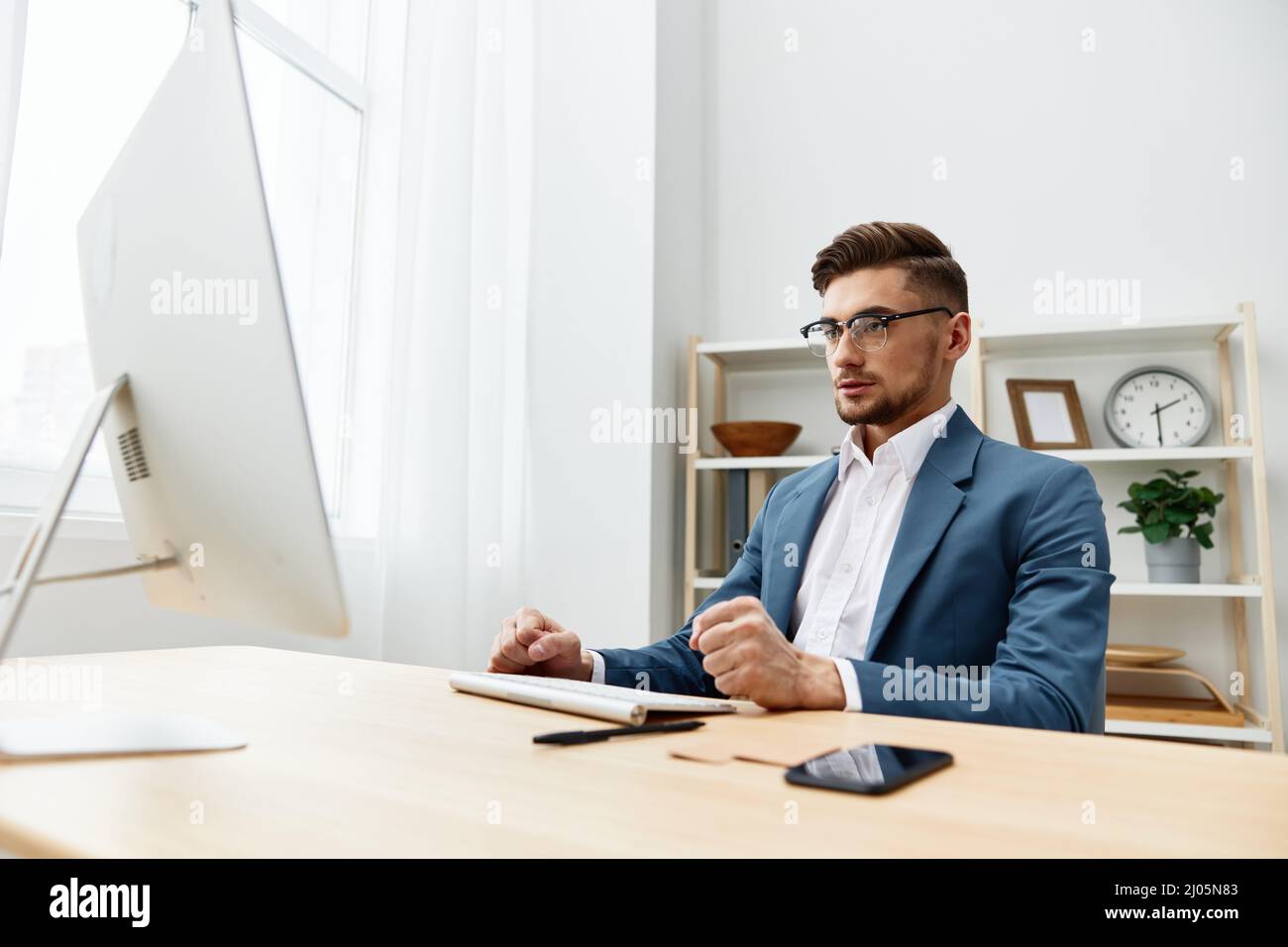 handsome businessman sitting at the computer work boss isolated ...