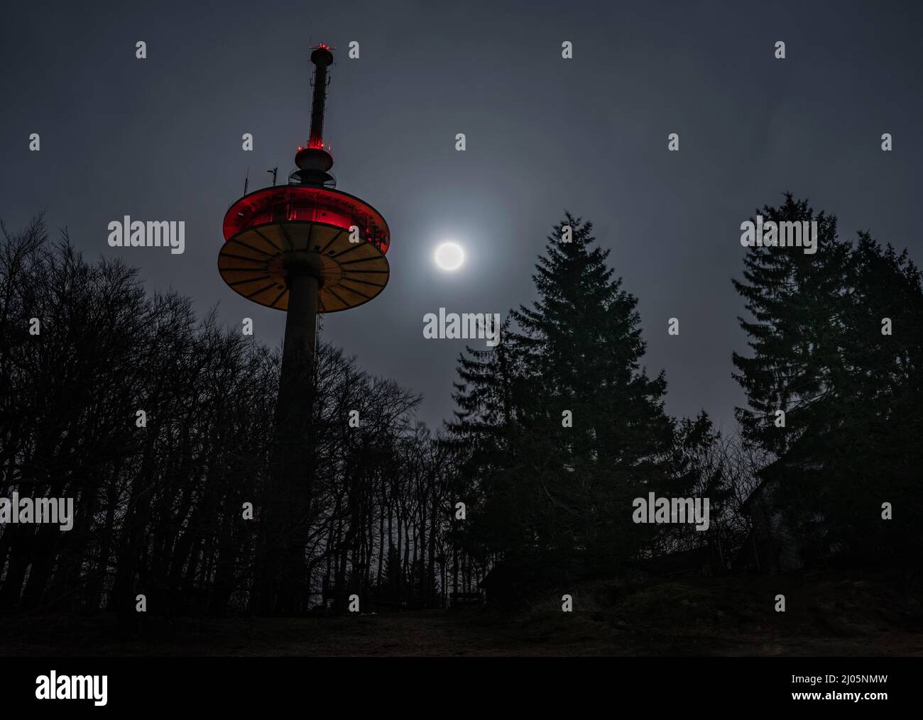 Schotten, Germany. 16th Mar, 2022. The illuminated telecommunications ...