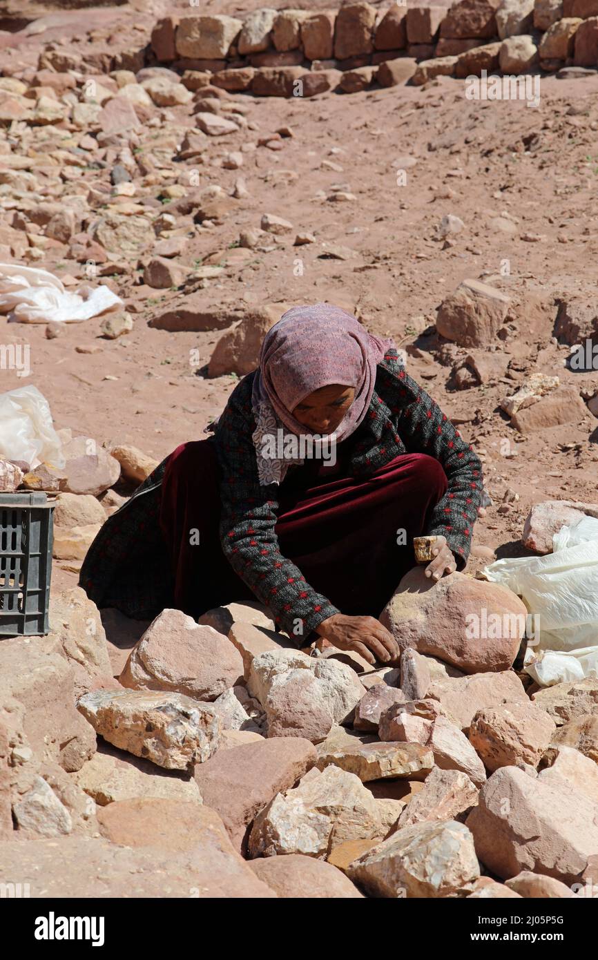 Woman breaking rocks hi-res stock photography and images - Alamy