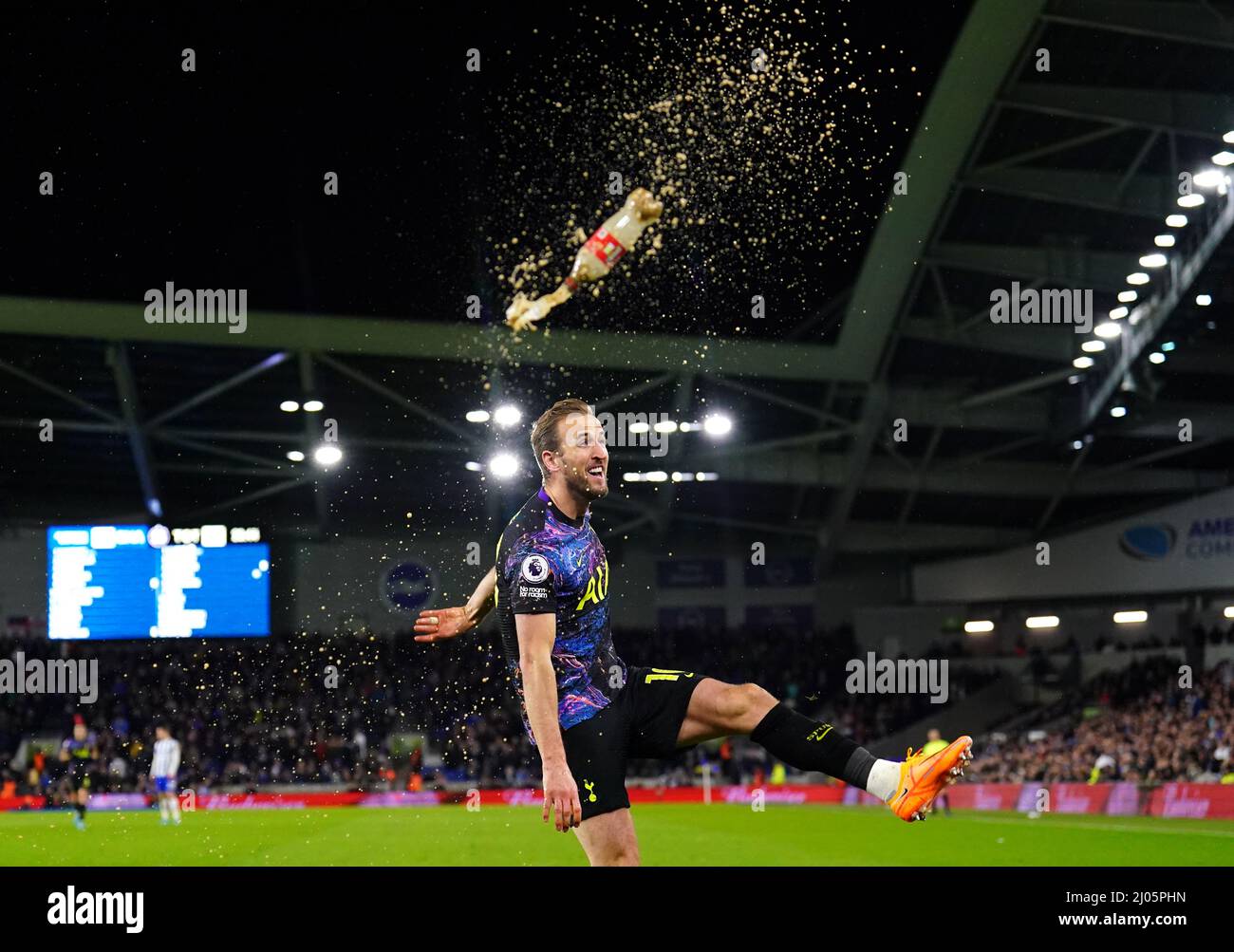 A bottle of cola is thrown as Tottenham Hotspur's Harry Kane celebrates ...