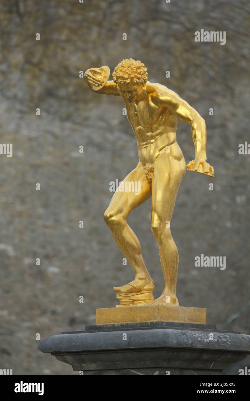 Golden satyr in the castle garden in Weilburg, Hesse, Germany Stock ...