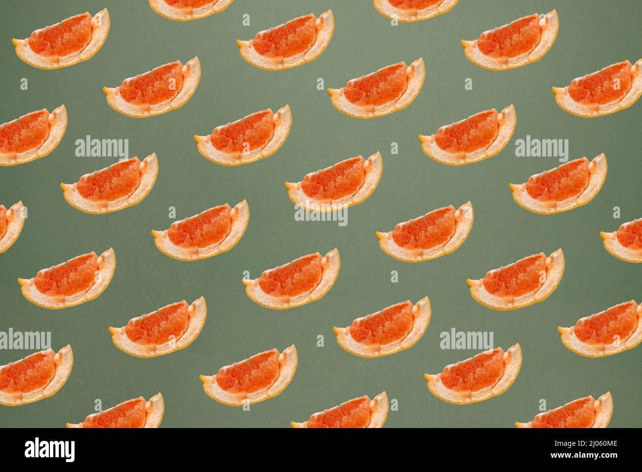 Minimal nature pattern with grapefruit slices. Pastel greeb background ...