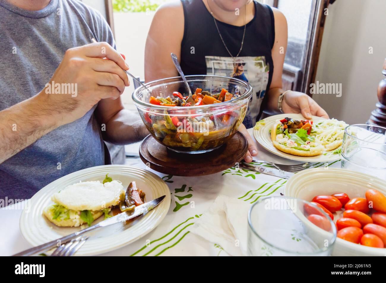 closeup of caucasian man with a glass bowl in his hand with cooked ...