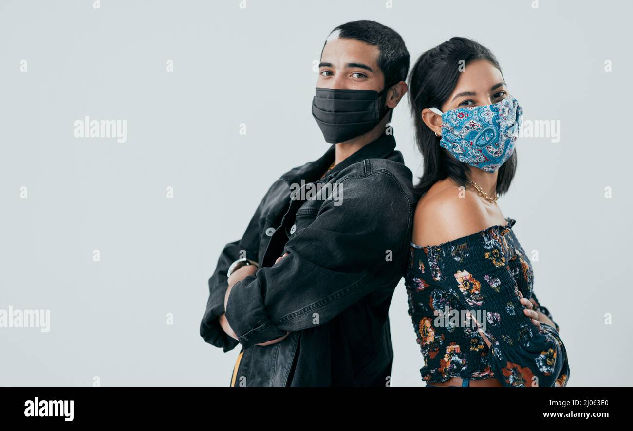 Bring on any challenge and well beat it. Studio shot of a masked young ...