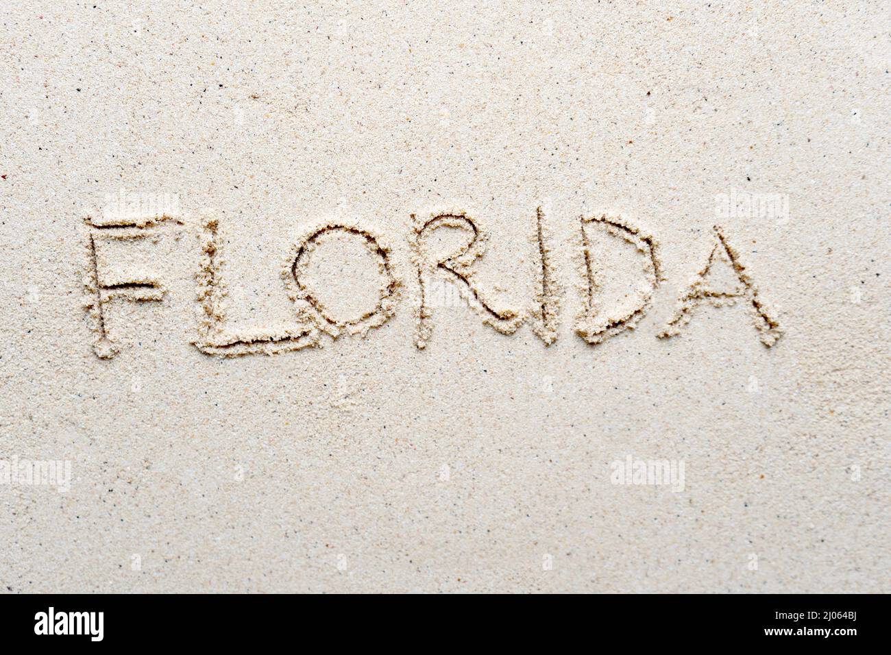 Handwriting words "Florida" on sand of beach Stock Photo - Alamy