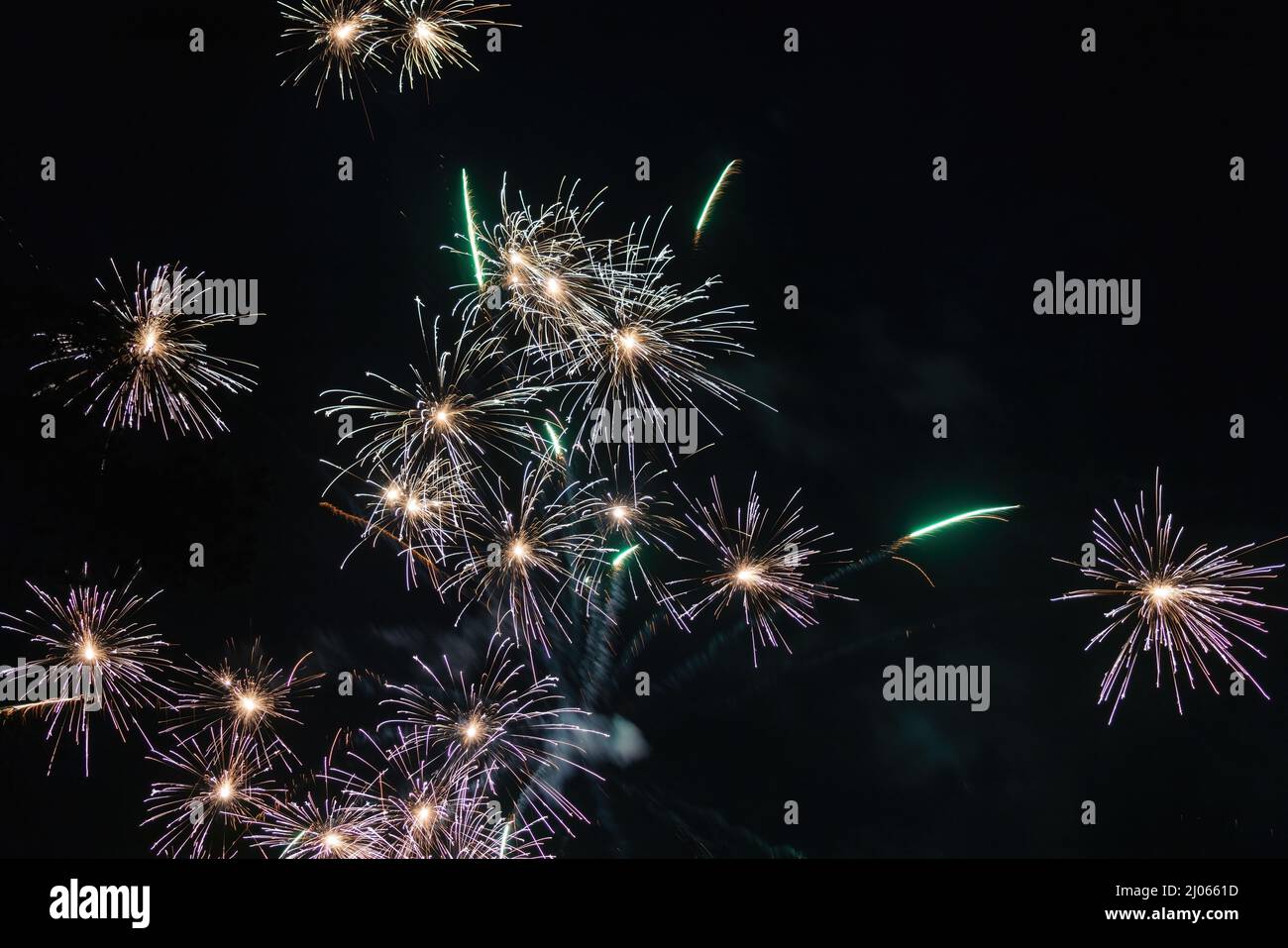 many small colorful sparks in dark night sky Stock Photo - Alamy