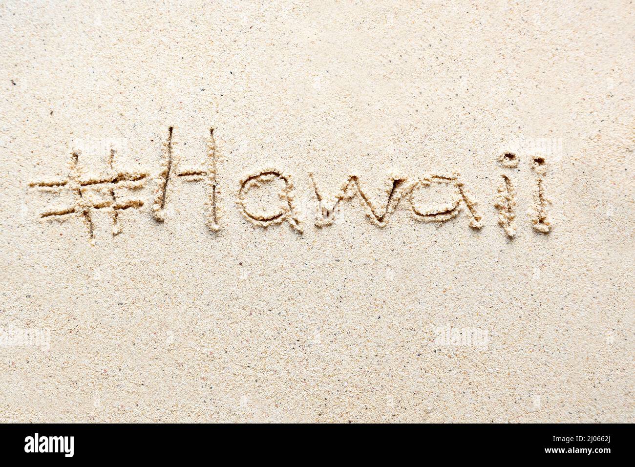 Hawaii written on sand hi-res stock photography and images - Alamy