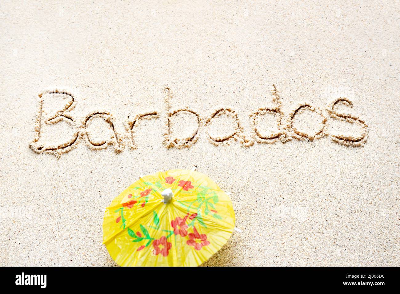 Handwriting words "Barbados" on sand of beach Stock Photo - Alamy