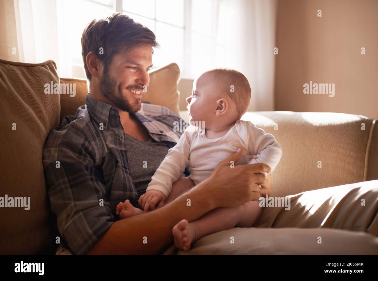 Sharing a smile with dad. Cropped shot of an affectionate father ...