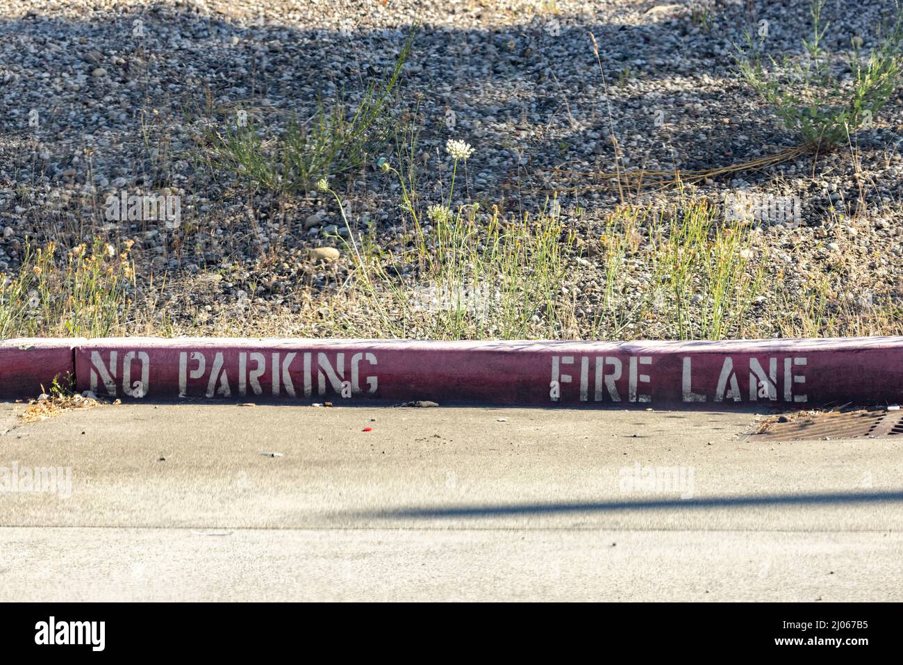 fire lane with dirt gravel area behind it Stock Photo - Alamy