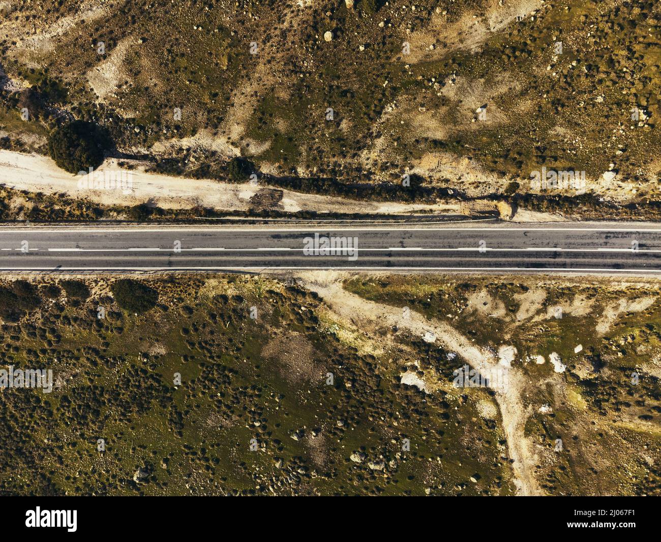 Top view of a country road with some meadow Stock Photo - Alamy