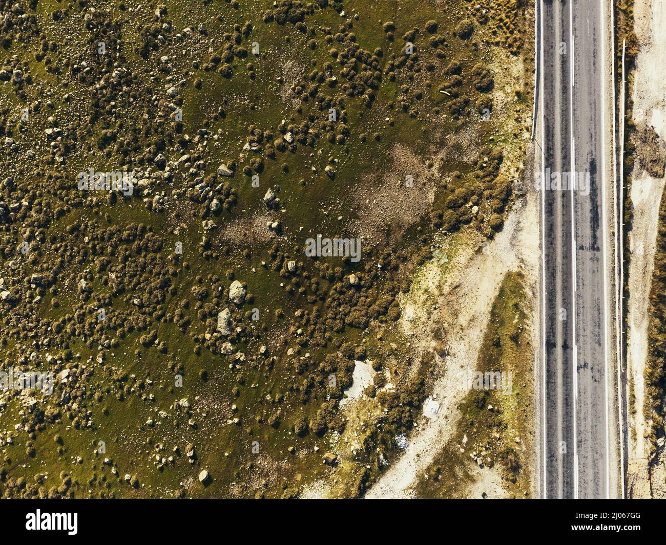 Top view of a country road with some meadow Stock Photo - Alamy