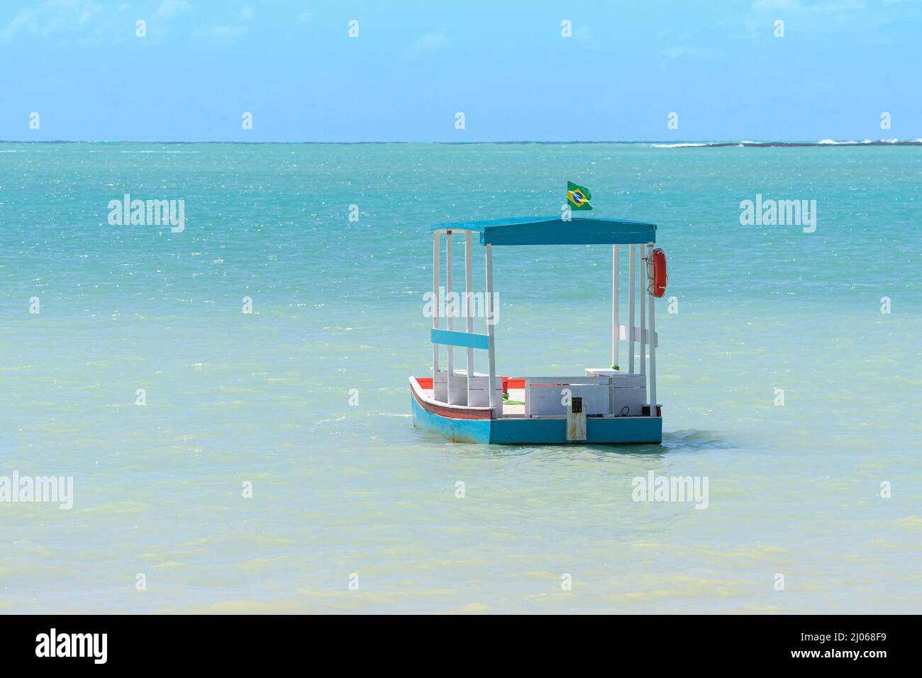 Landscape of a small tourist raft in the middle of sea on Barra Grande ...