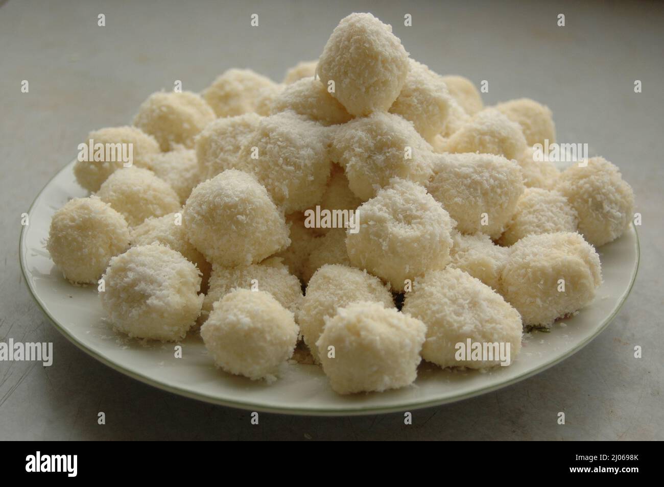 Homemade Raw Coconut Candies Stacked Stock Photo - Alamy