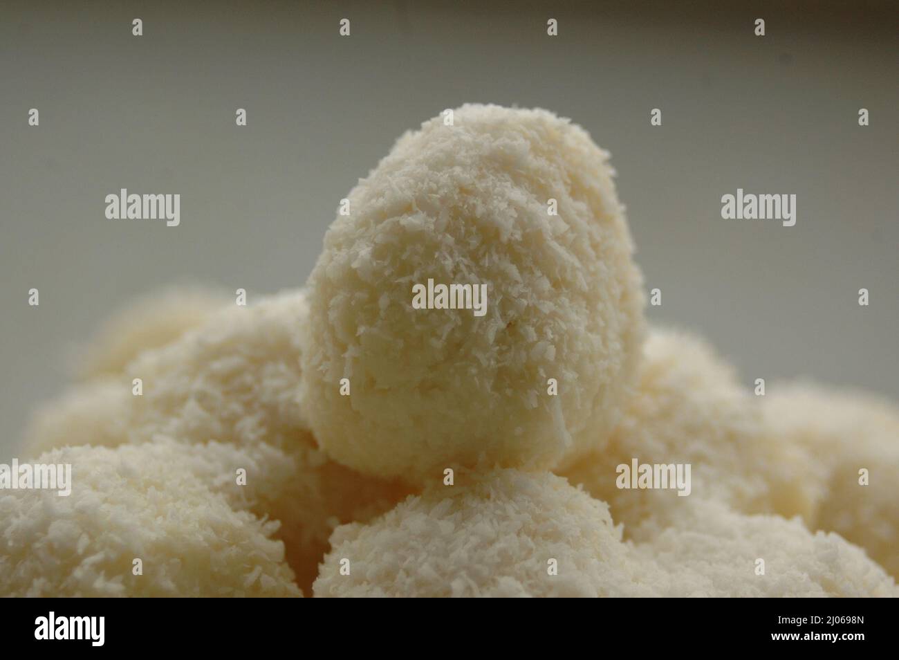 Homemade Raw Coconut Candies Stacked Stock Photo - Alamy
