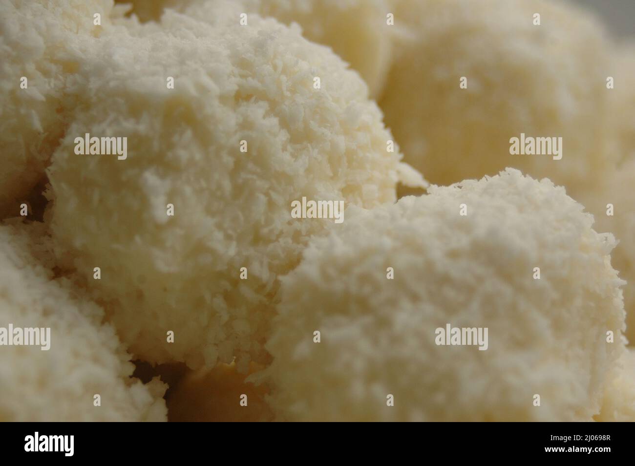 Homemade Raw Coconut Candies Stacked Stock Photo - Alamy