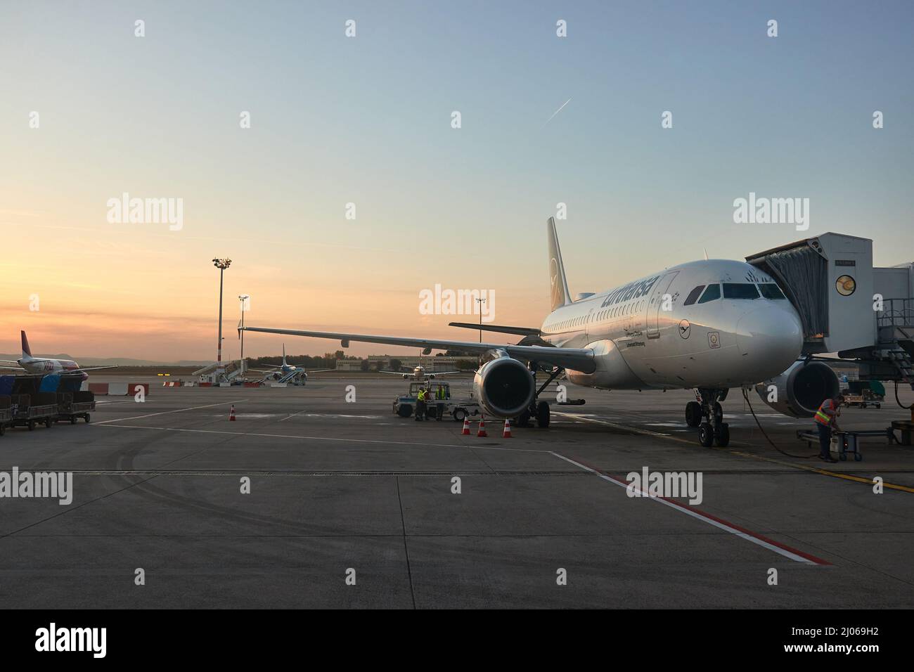 Airplane arriving at the terminal Stock Photo - Alamy