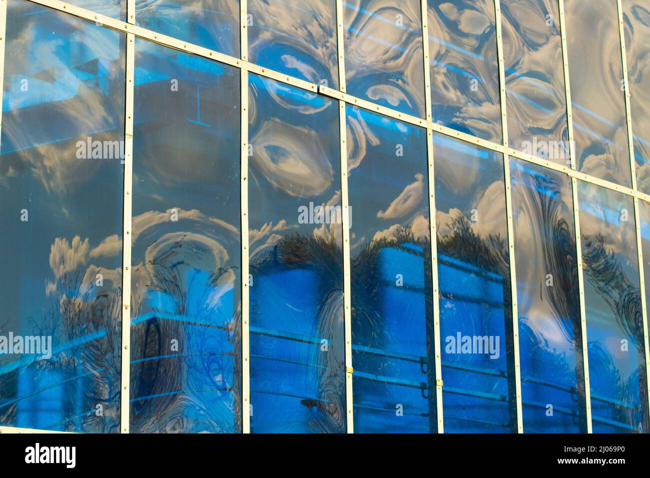 Details of the building. Blue transparent plastic. Light on the windows ...