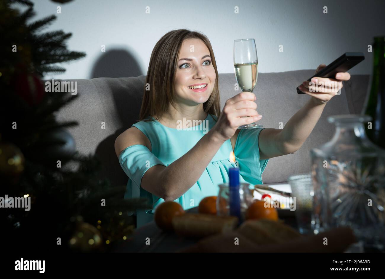 Woman watching tv alone hi-res stock photography and images - Alamy