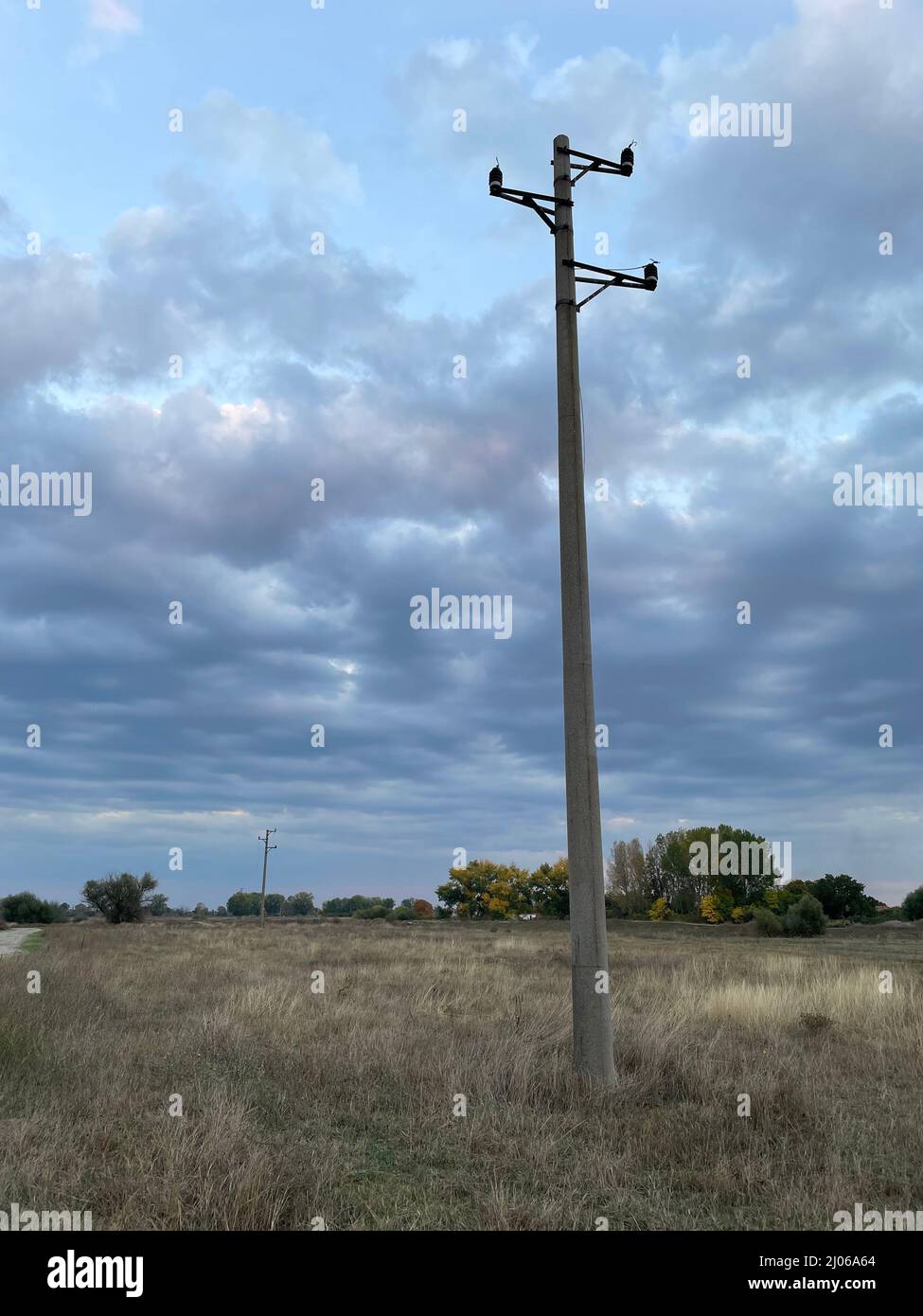 Old Village Power Line Pylon Stock Photo - Alamy