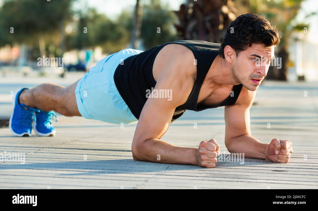 Serious man doing plank hi-res stock photography and images - Alamy