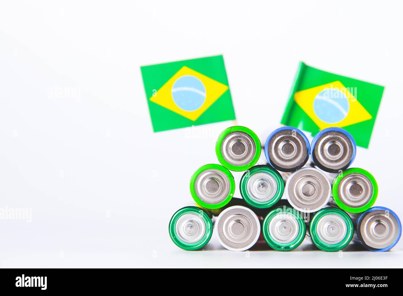 Battery. A lot of batteries on the background of the flag of brazil ...