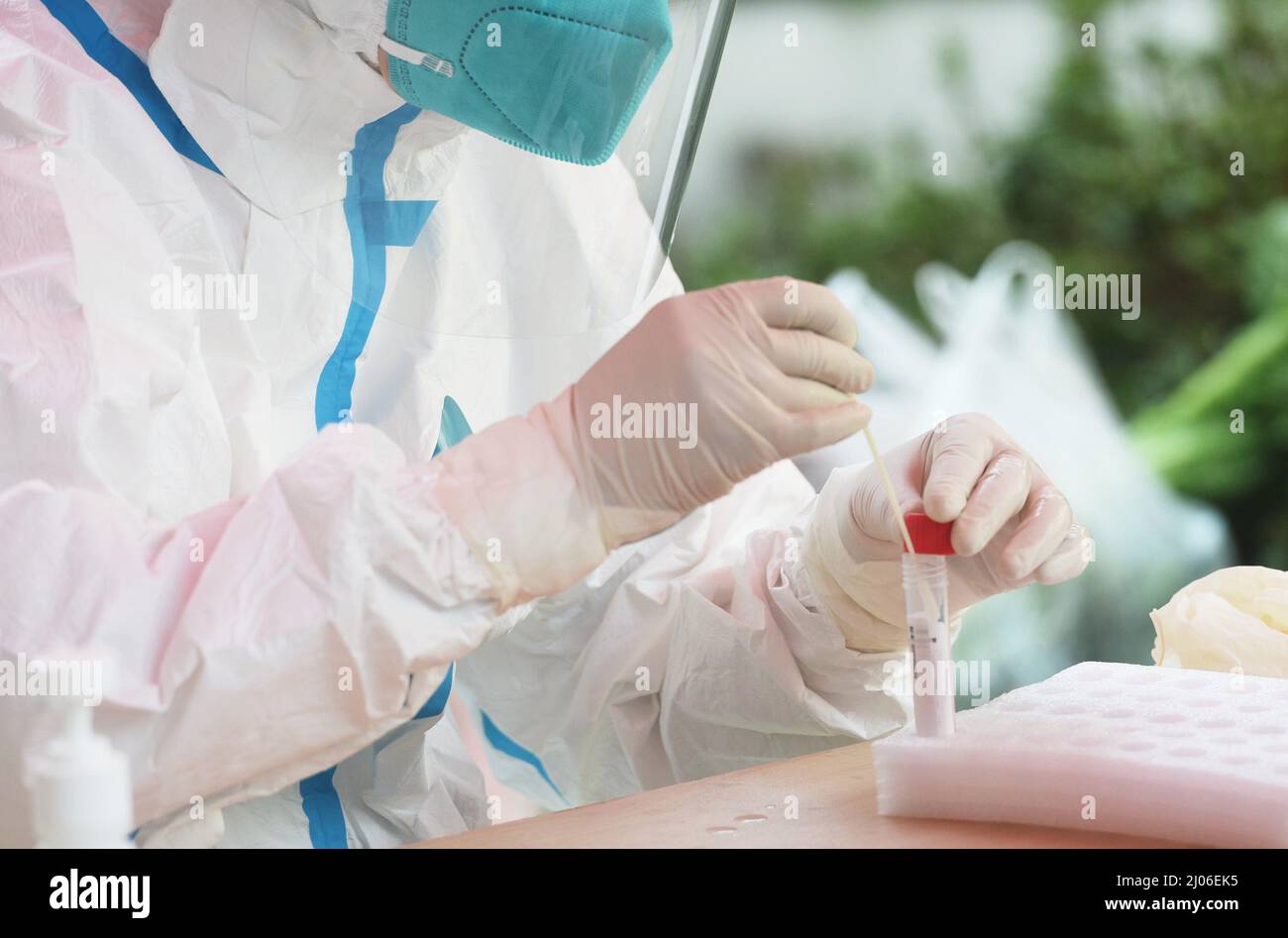 HANGZHOU, CHINA - MARCH 17, 2022 - A medical worker puts a nucleic acid ...
