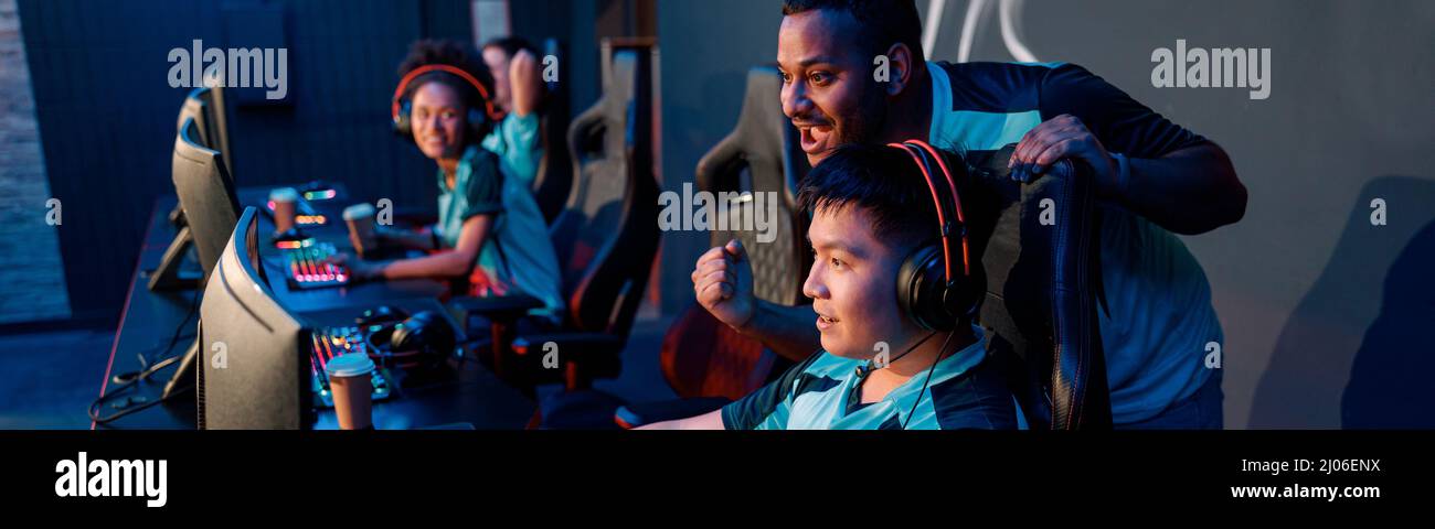 Professional esports players playing online games in internet cafe ...