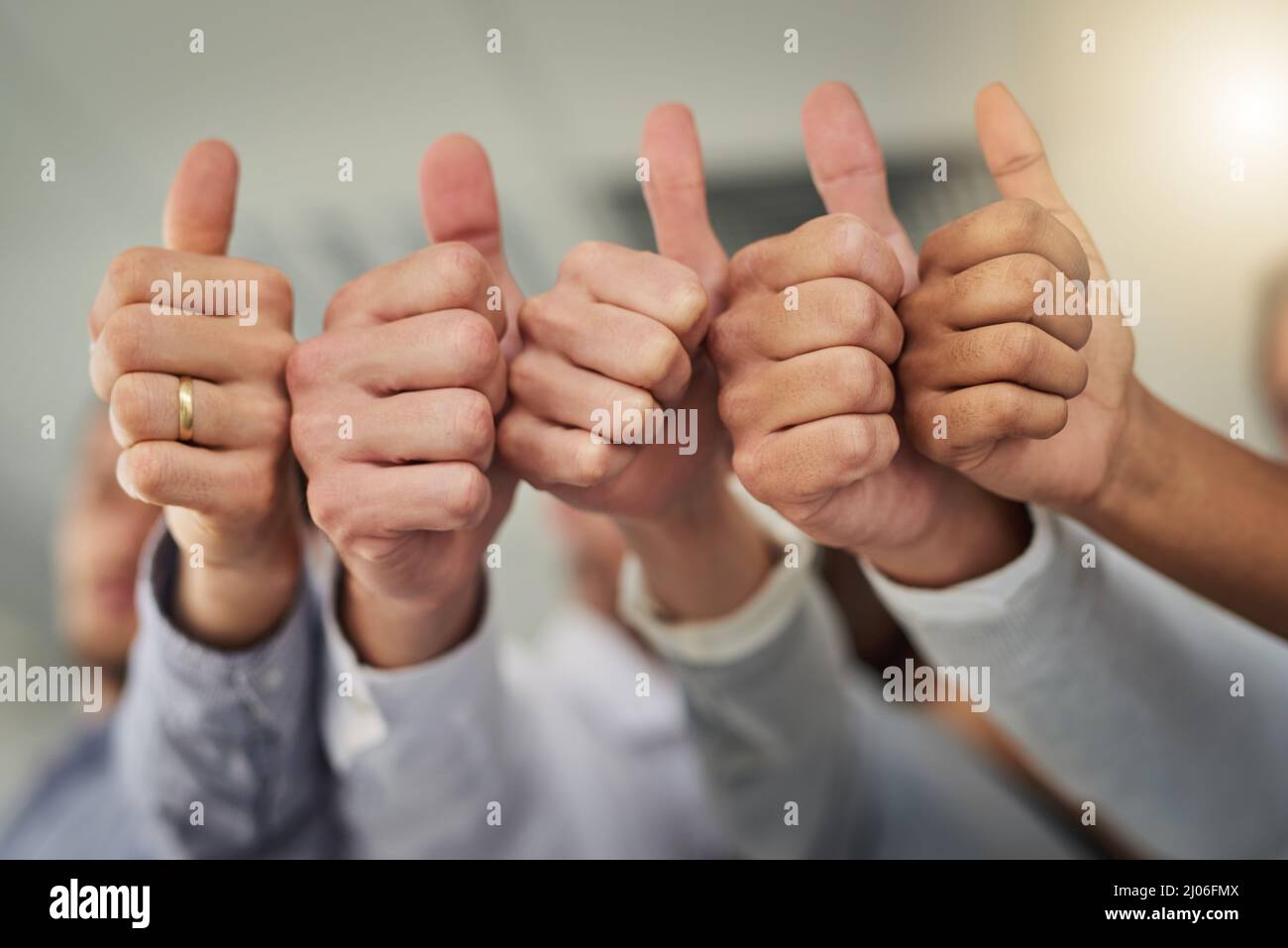 Well done on your win. Cropped shot of a group of businesspeople giving ...