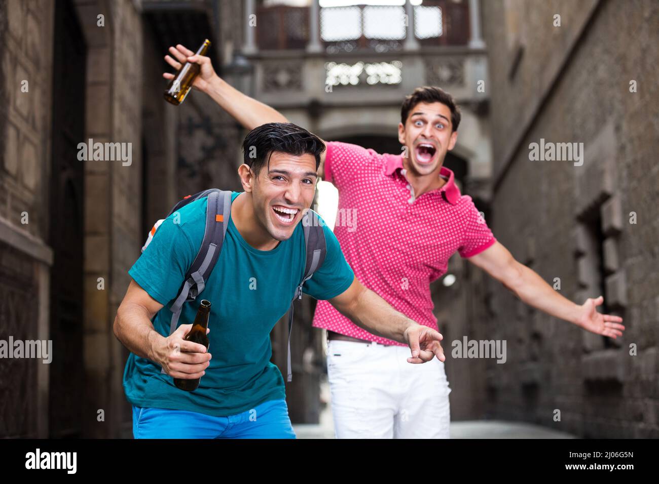 two positive male fans who are walking with beer in Barcelona Stock ...